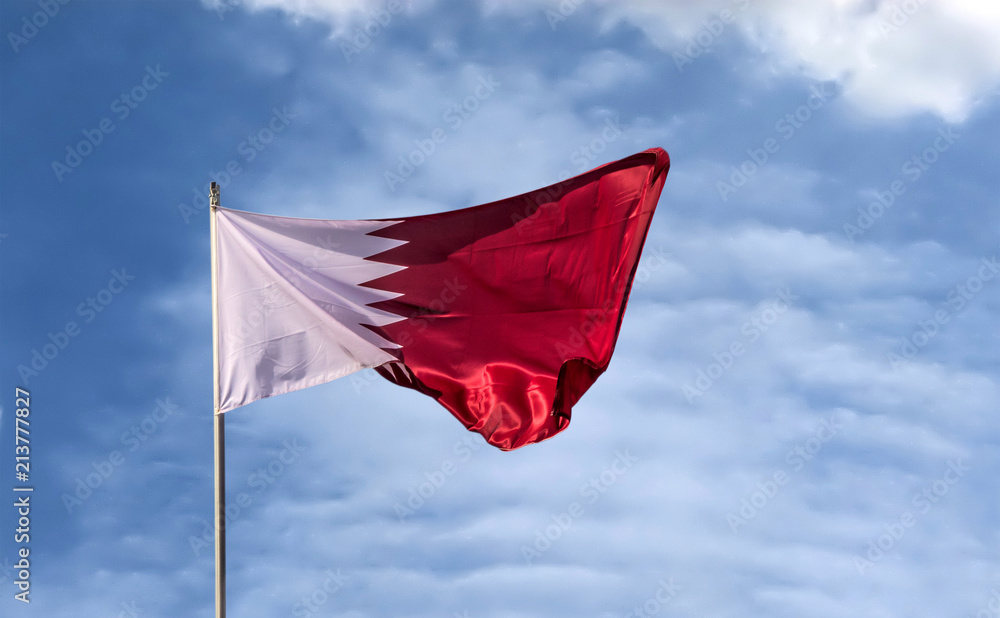 Flag of the country Qatar waving in the wind Stock Photo | Adobe Stock