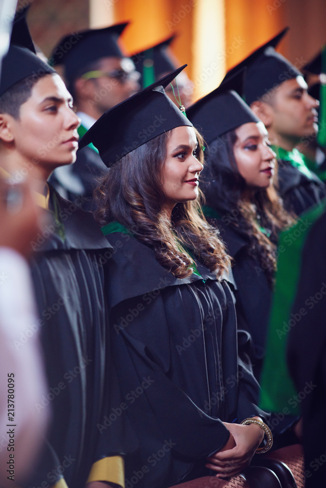 grroup of happy graduate students in gowns on graduation ceremony Stock ...