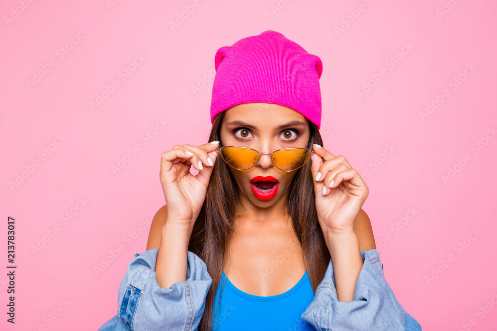 WOW! Close up portrait of shocked girl face looks over the glasses ...