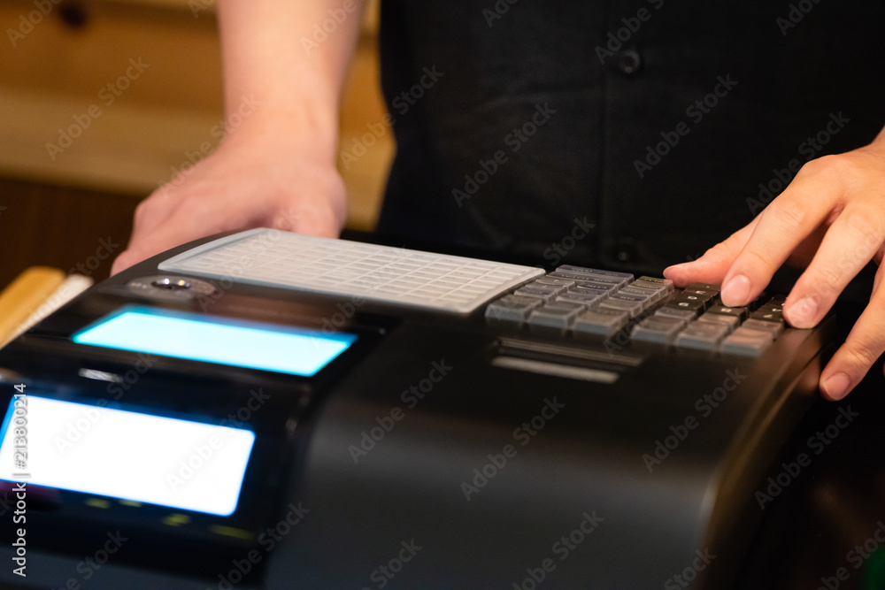 cash register installed on counter for accepting order from customer ...