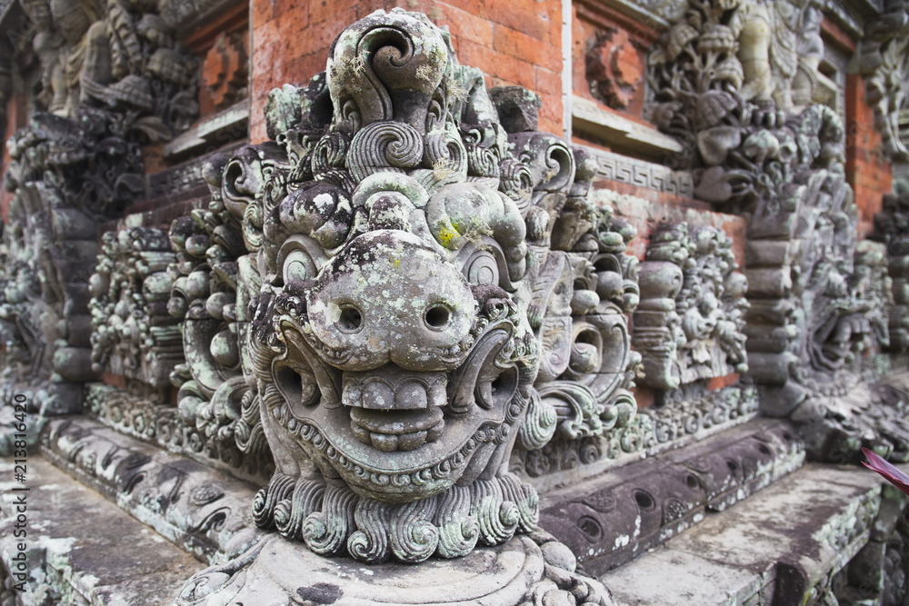 Carvings depicting demons, gods and Balinese mythological deities on ...