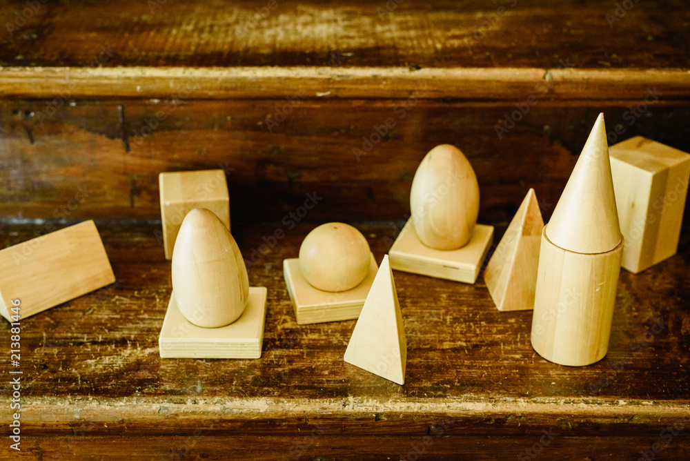 Solid wood shapes to study geometry and volumes, cones, triangles ...