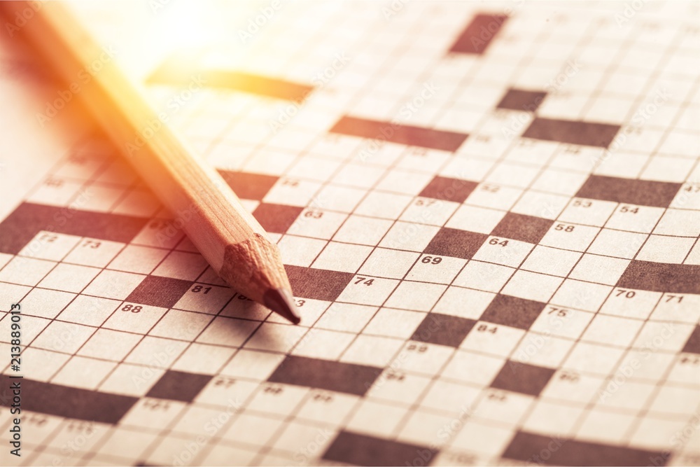 Crossword puzzle and pencil Stock Photo | Adobe Stock