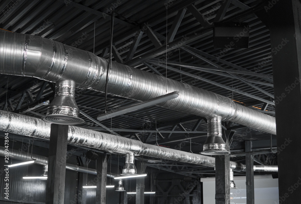 Ventilation system on the ceiling of large buildings. Ventilation pipes ...