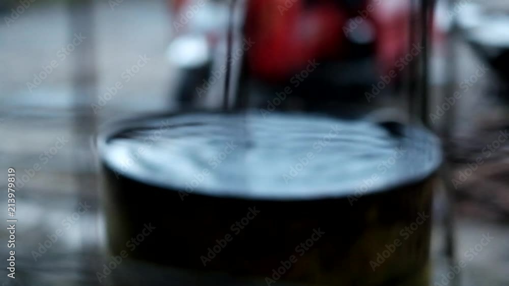 Vidéo Stock A shot slowly focusing to a barrel of water behind a metal ...