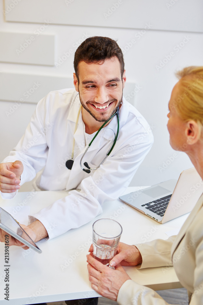 Doctor giving friendly advice Stock Photo | Adobe Stock