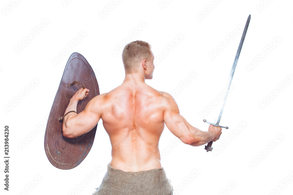 Bodybuilder man posing with a sword and shield isolated on white ...