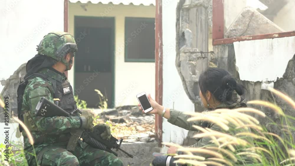 Soldier fieldwork interview with presswoman. Reporter unsafe area ... Soldier fieldwork interview with presswoman. Reporter unsafe area ...