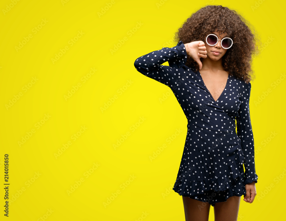 African american woman with sunglasses and summer dress with angry face ...