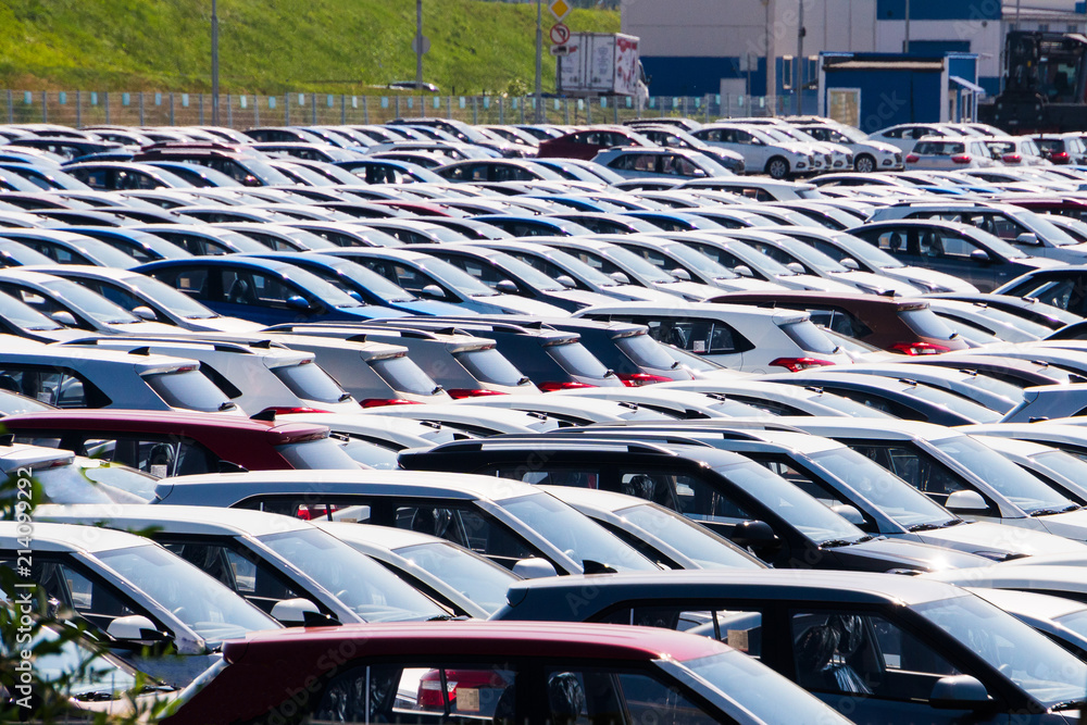 Storage Parking Lot of New Unsold Cars. Cars of different classes and ...