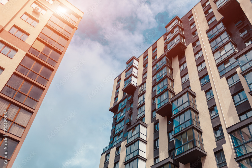 New multi-storey residential building. Modern house on sky background ...