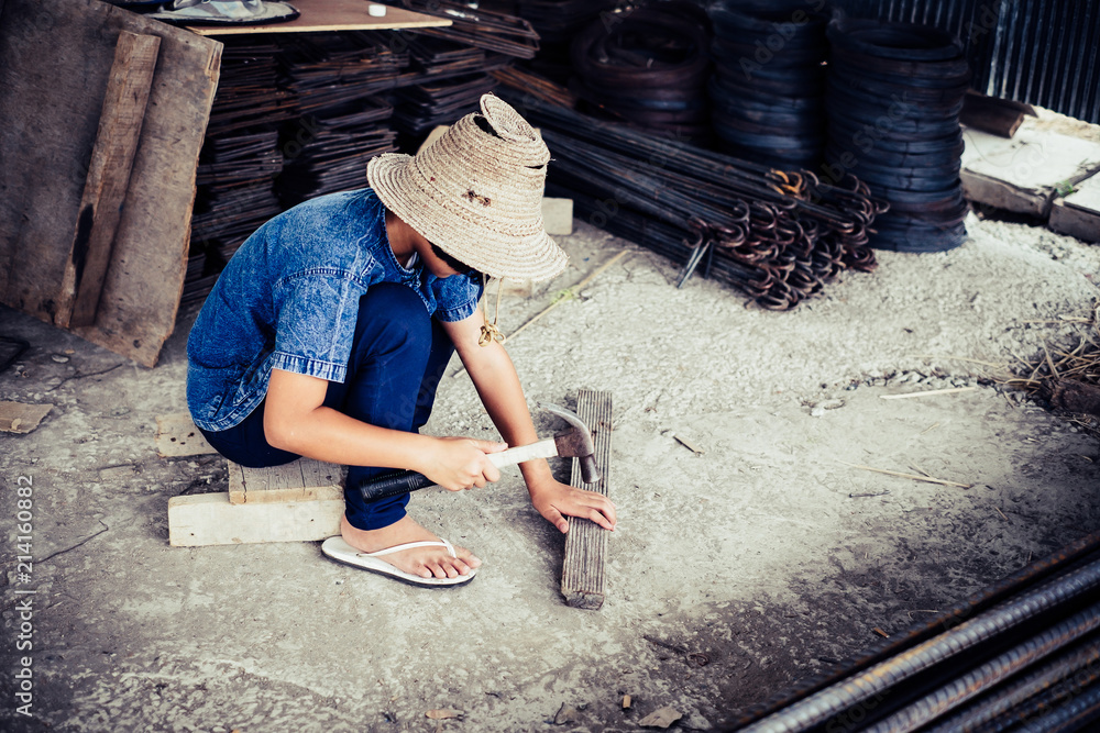 Little girl labor working in commercial building structure, World Day ...