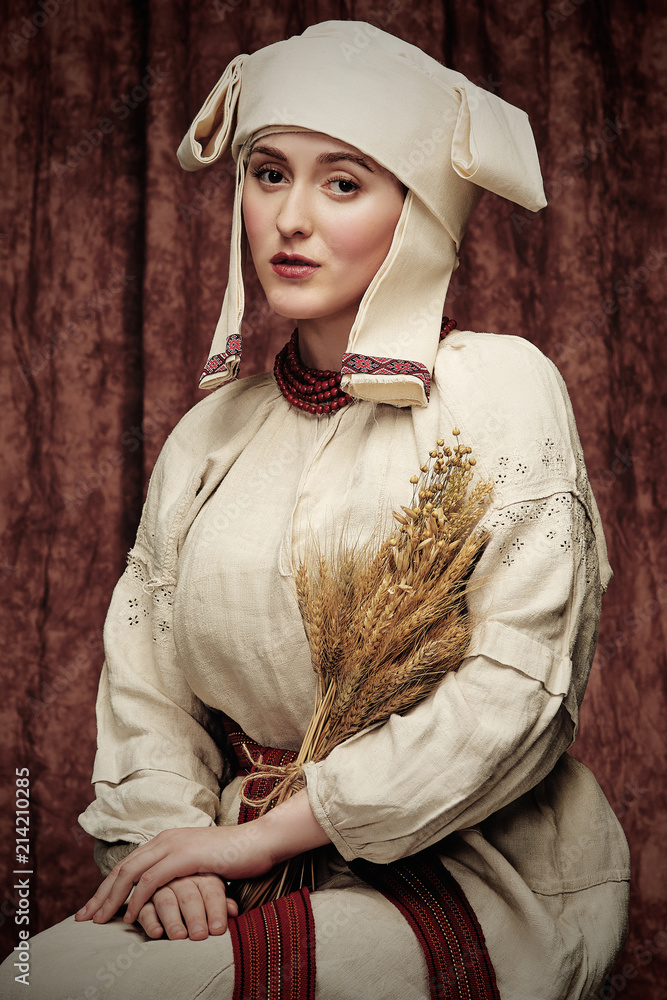 Three quarter isolated portrait of a young Slavic woman in ethnic ...