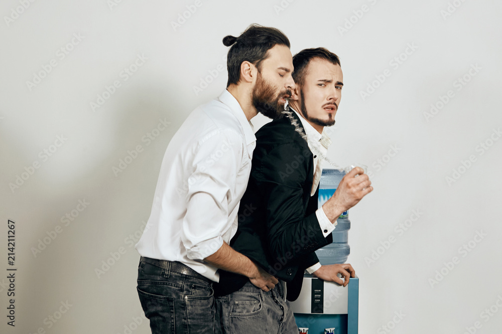 Sexual abuse at work. A male boss assaulting a male employee from ...