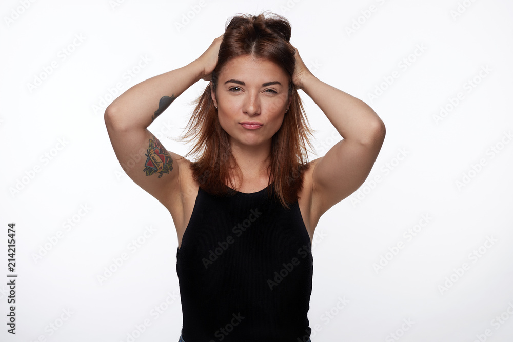 Portrait of beautiful woman with short hair winking while having good ...