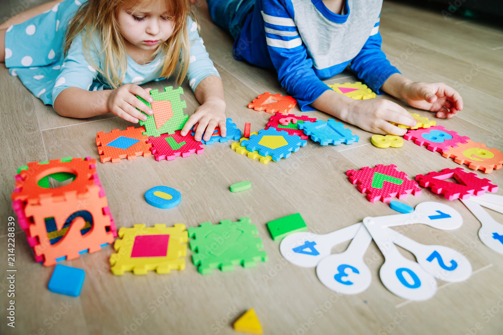 kids learning numbers, calculations, play with puzzle Stock Photo ...