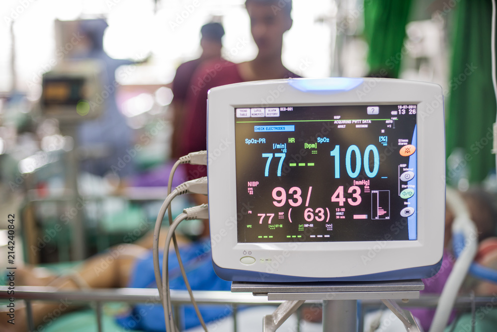 Modern vital sign monitor on patient background at ward in the hospital ...