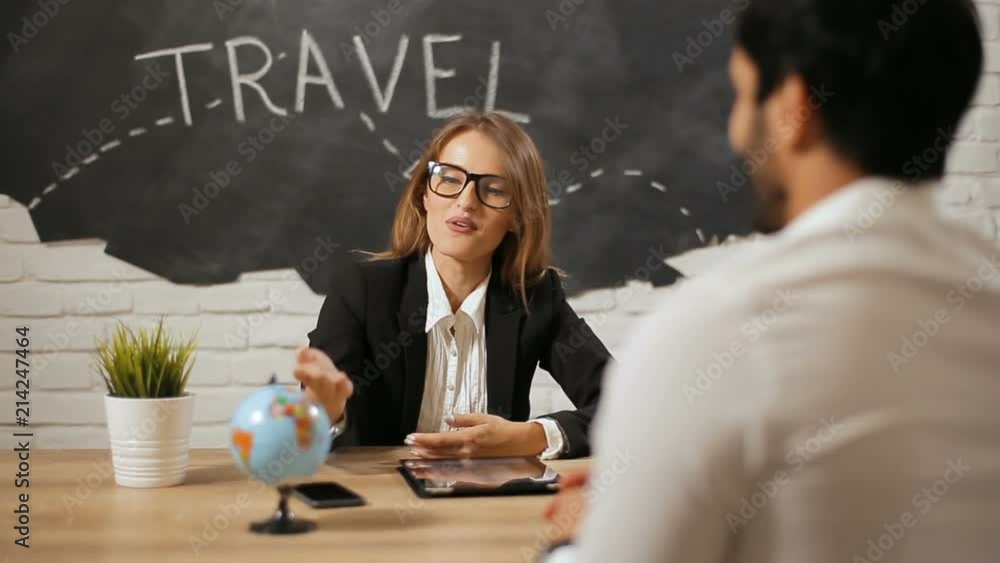 Smiling bright travel agent having meeting with client, attractive ...