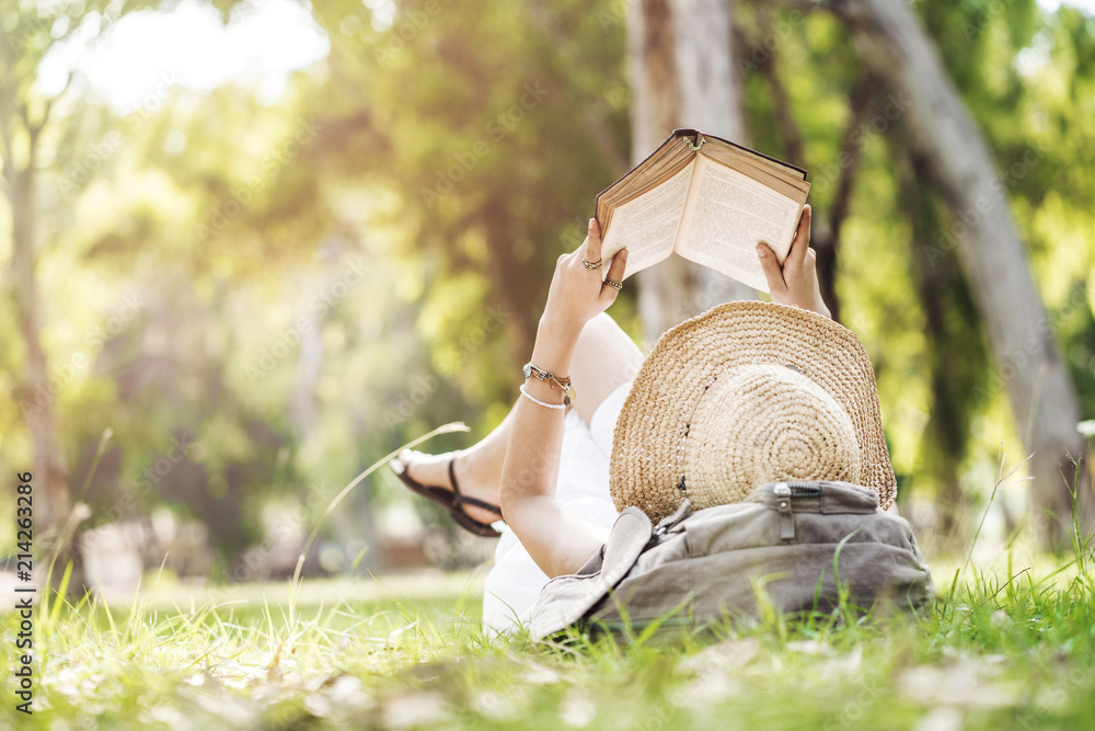 Reading a book at park Stock Photo | Adobe Stock
