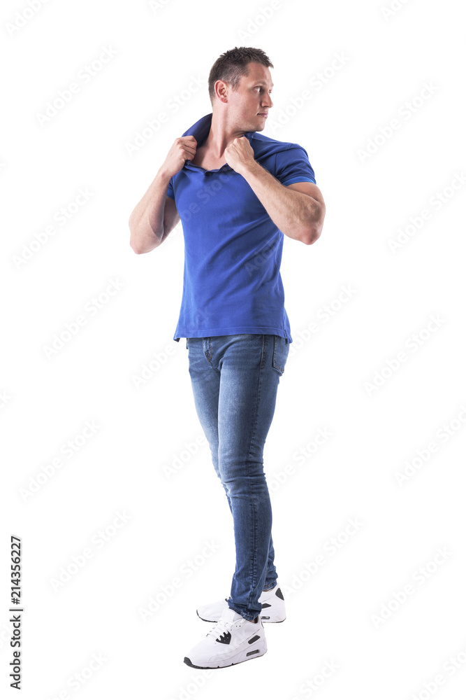 Adult male fashion model holding collar posing and looking back over ...