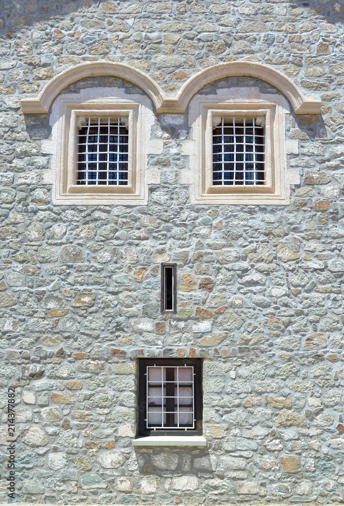 Window on a stone wall of the house. Due to the windows location ...
