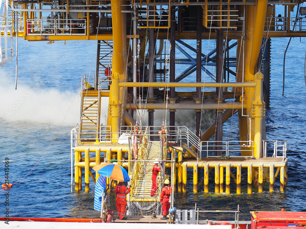 Cement dust from jack up rig is blown near platform sea deck. Stock ...