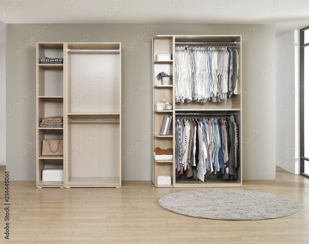 Big wardrobe with different clothes for dressing room. Interior ...