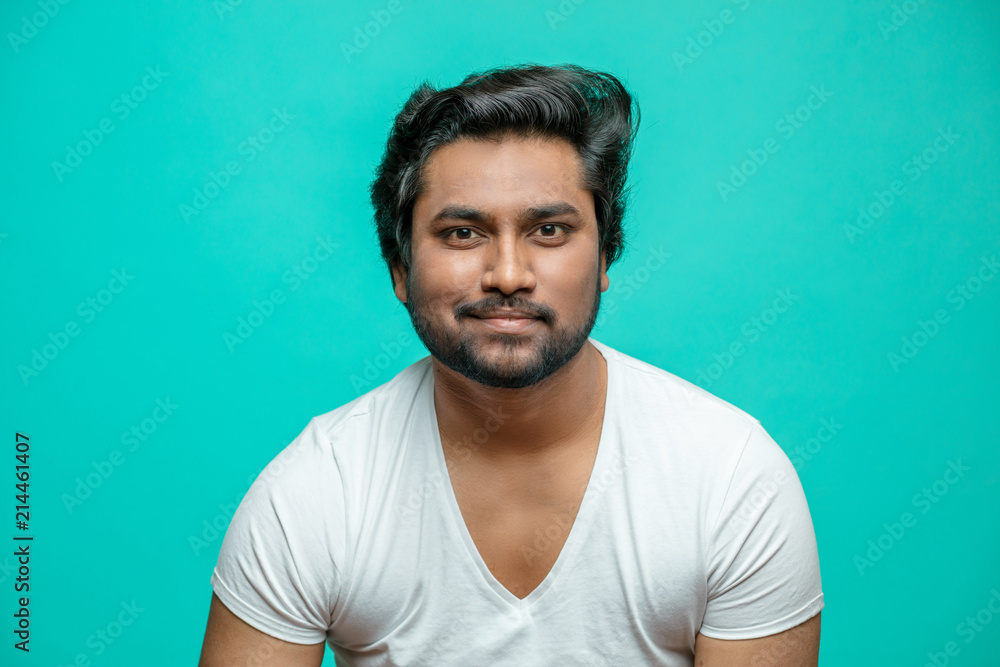 smiling bearded brutal Indian guy looking at the camera. bodybuilder in ...