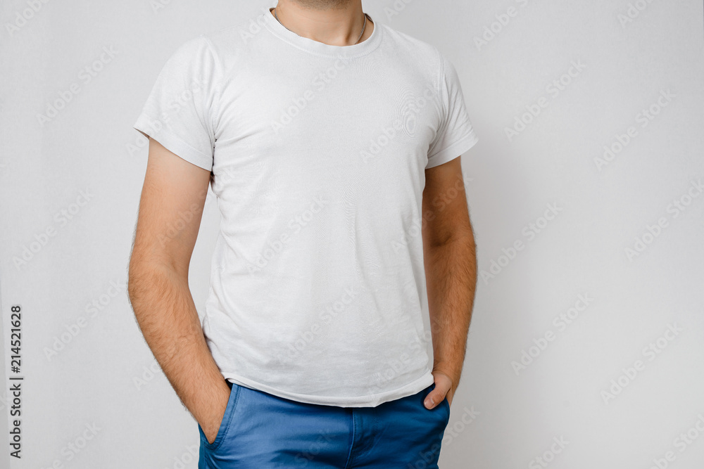 Shirt design, close up of young man in blank white tshirt front view ...