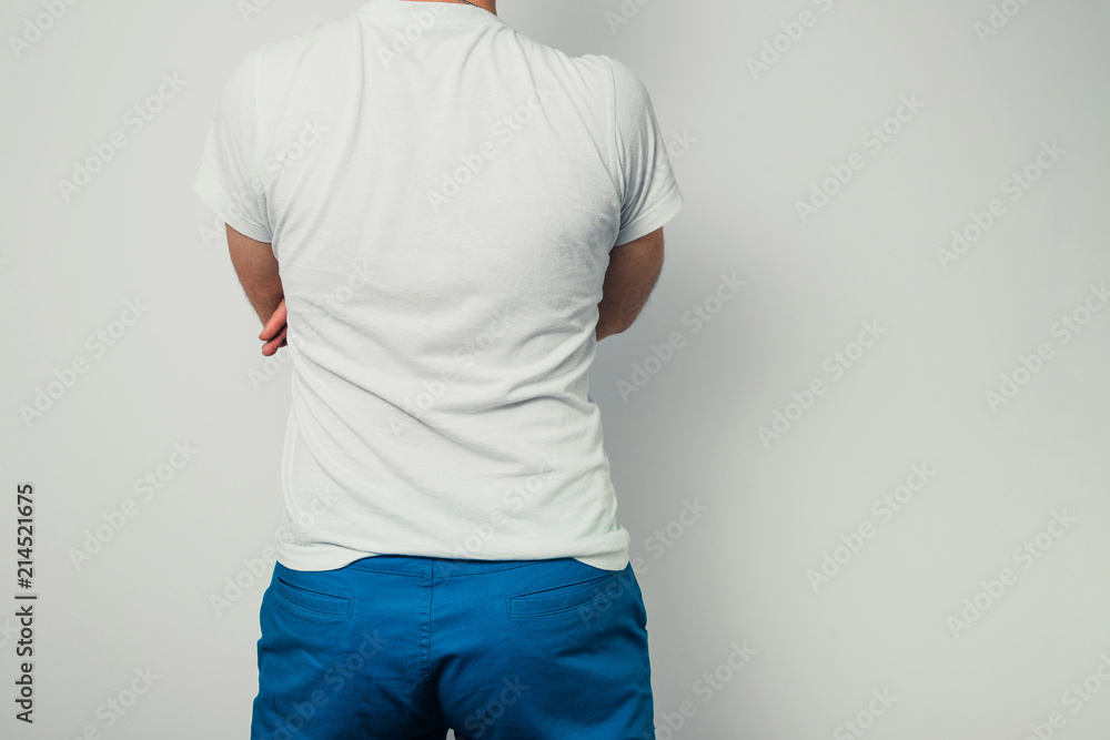 Shirt design, close up of young man in blank white tshirt back view ...