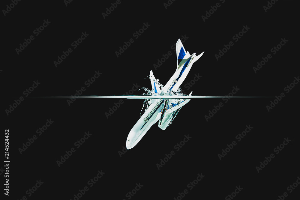 White plane hits for water, black background. Airplane dropping in ...