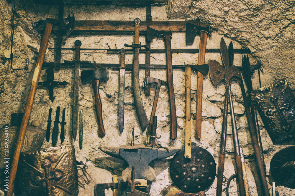 Wallpaper background of ancient medieval weapons hanged on a vintage ...