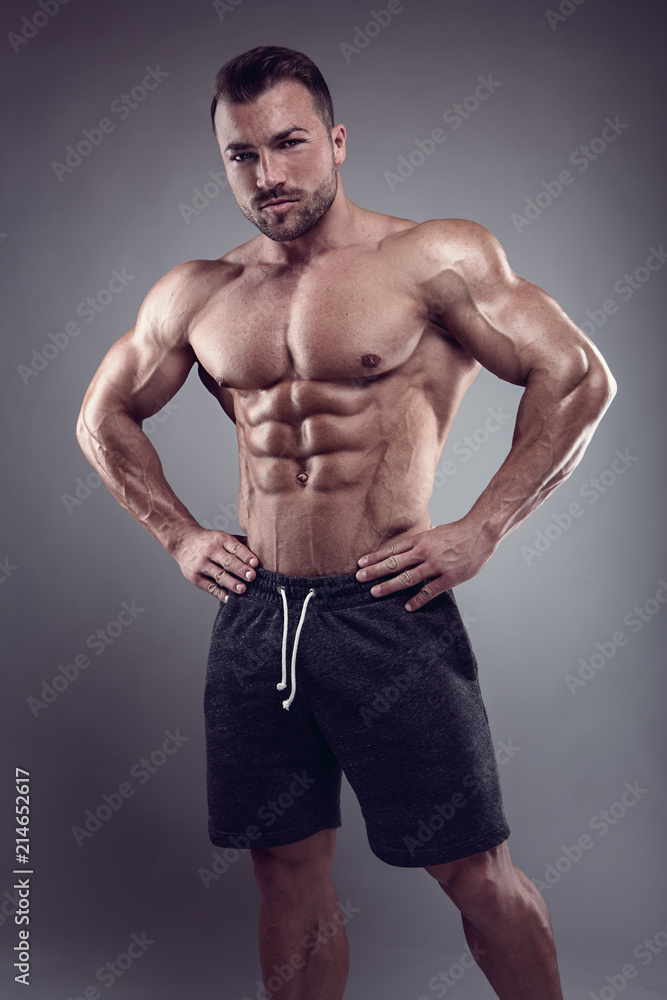 Strong Athletic Man shows body and abdominal muscles Stock Photo ...