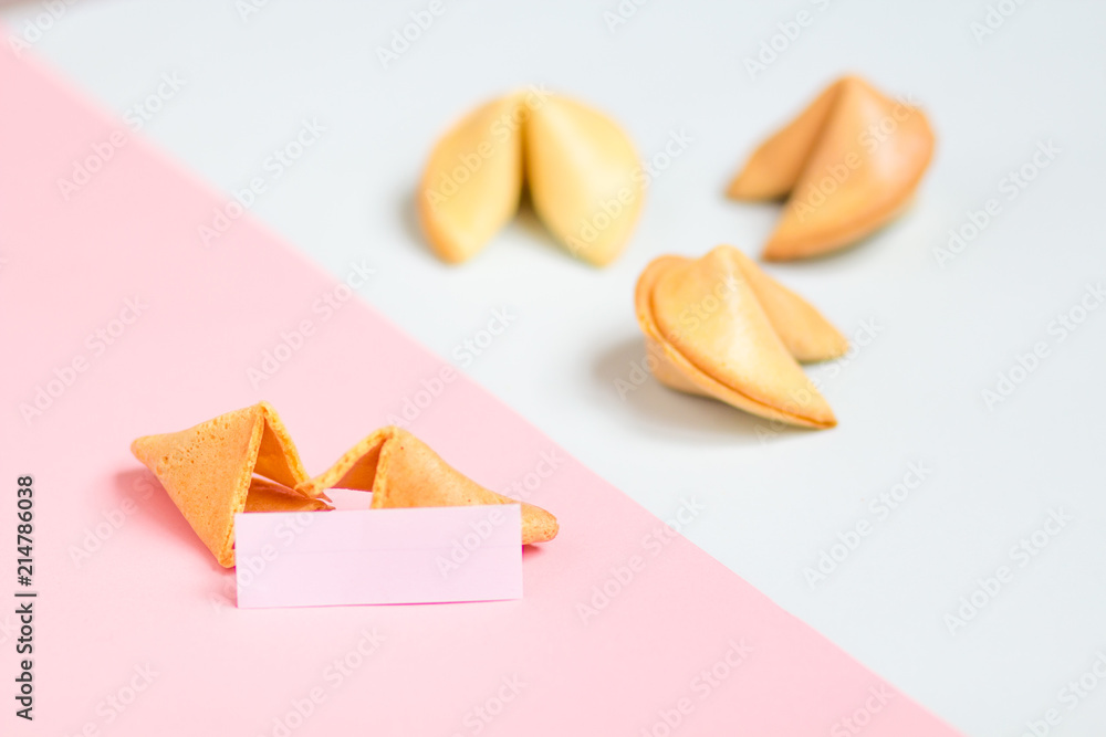 fortune cookie on pink and blue background, pastel colors, copy space ...
