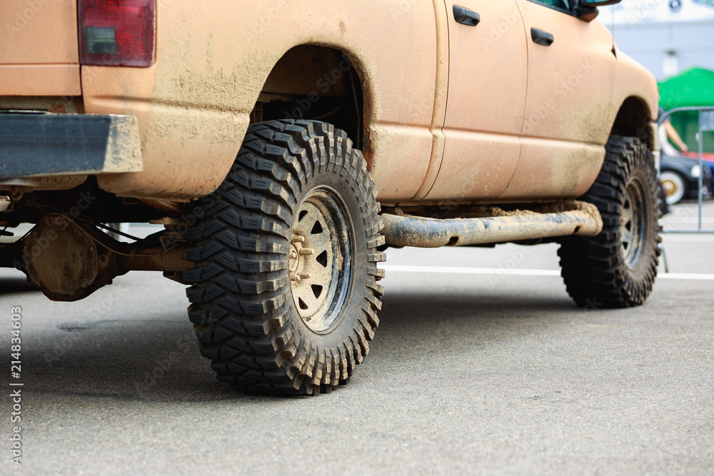 Wheel of an off-road car. Extreme adventures, off-road trip, SUV, bad ...