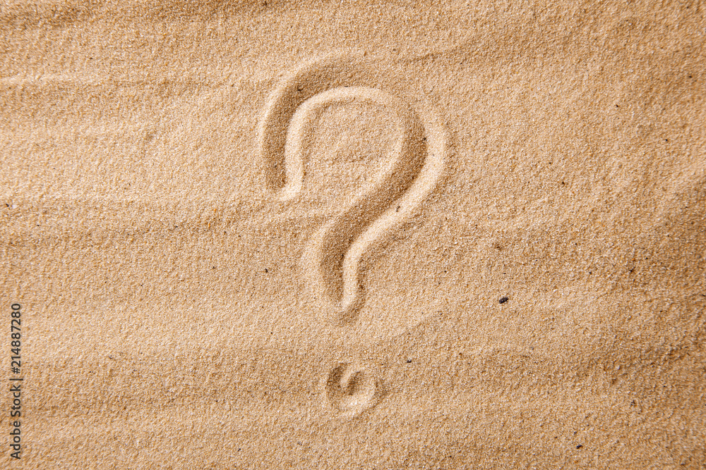 The question mark is sand painted on sand. Symbol of choice and doubt ...