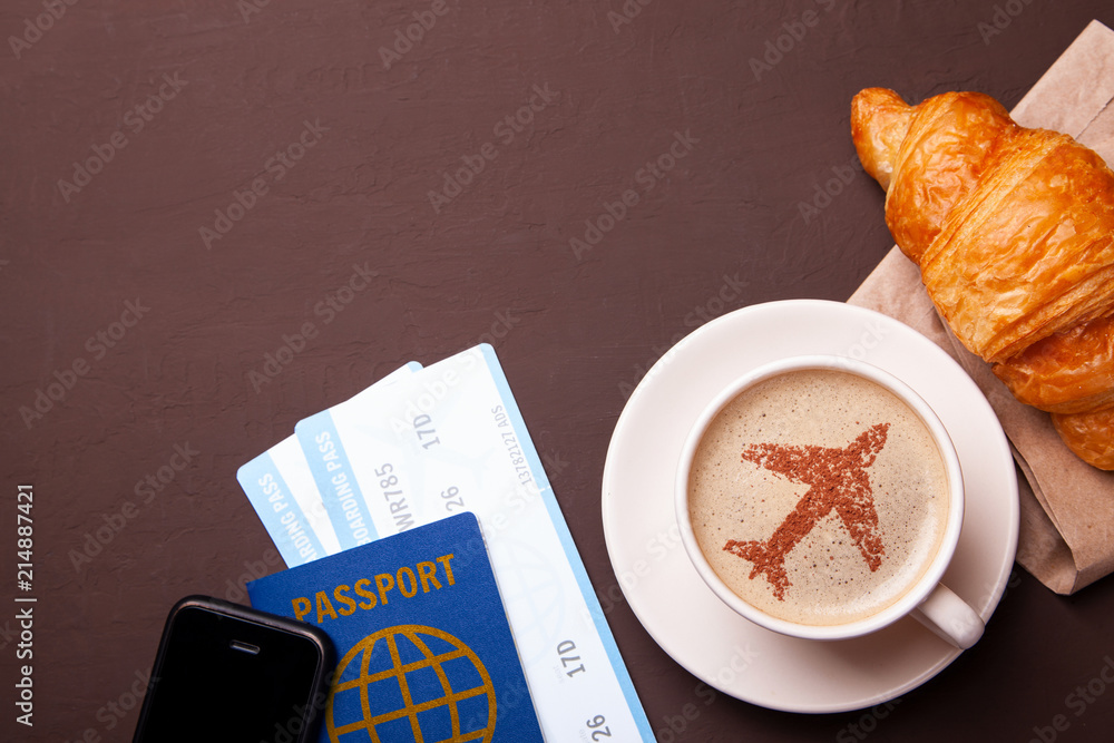 cup of coffee with an airplane on the foam. Morning coffee with ...