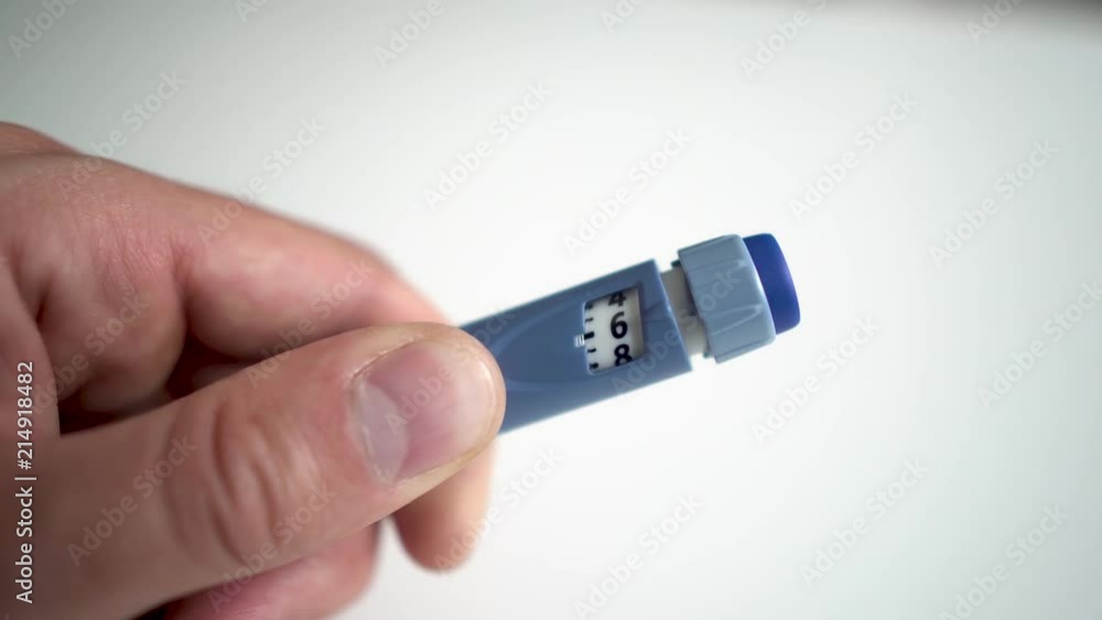 Dosing insulin with insulin pen Stock Video | Adobe Stock
