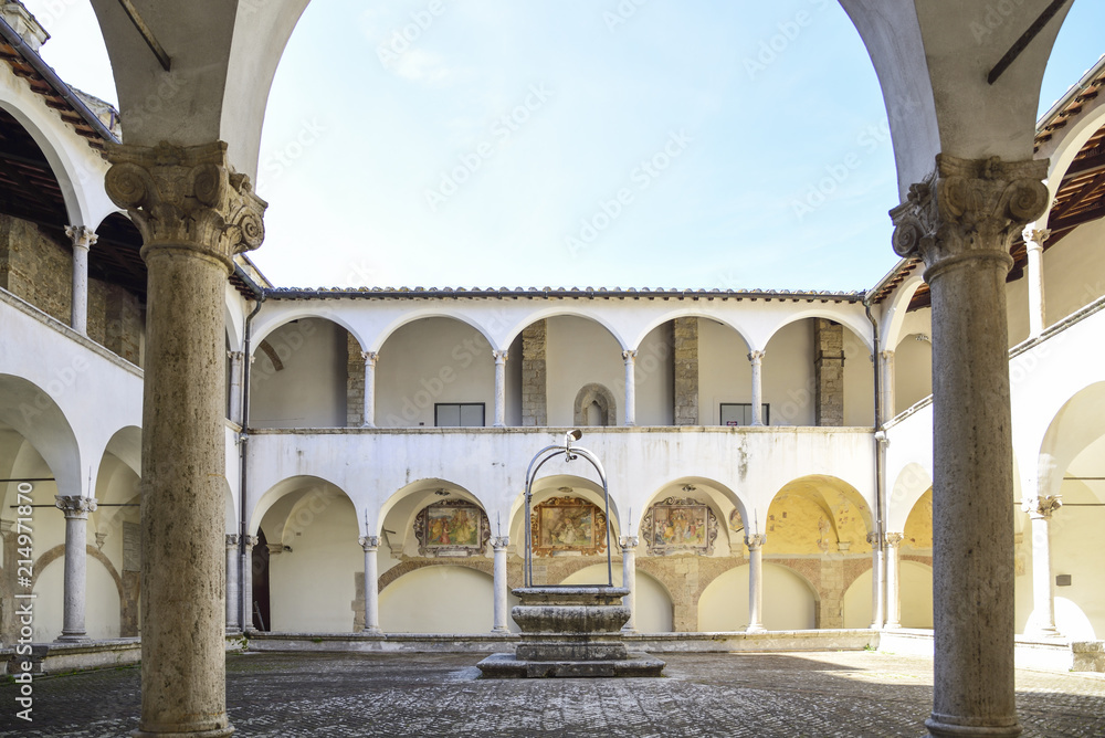 Ancient Franciscan cloister with columns and capitals in Corinthian ...