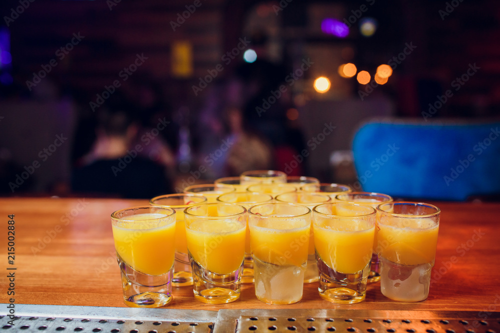 Foto de Shots on a bar counter top laid out with a billiard pyramid do ...