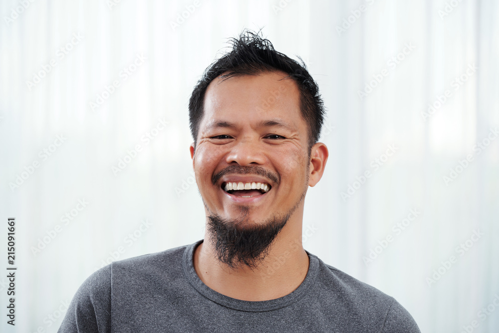 Positive Filipino man Stock Photo | Adobe Stock
