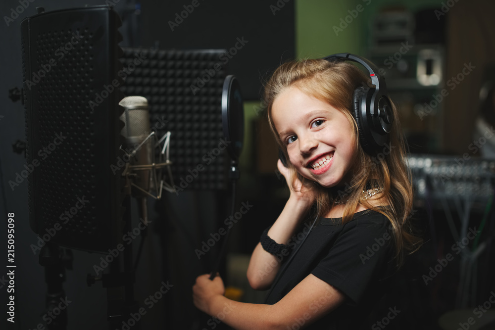 little girl singing in recording studio Stock Photo | Adobe Stock