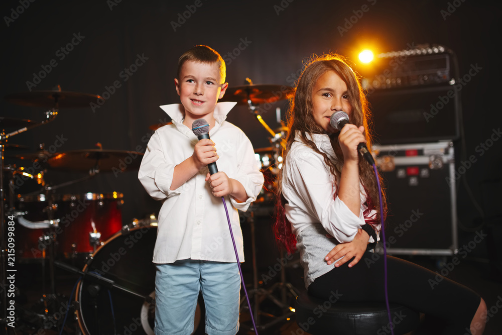 boy and girl singing in recording studio Stock Photo | Adobe Stock