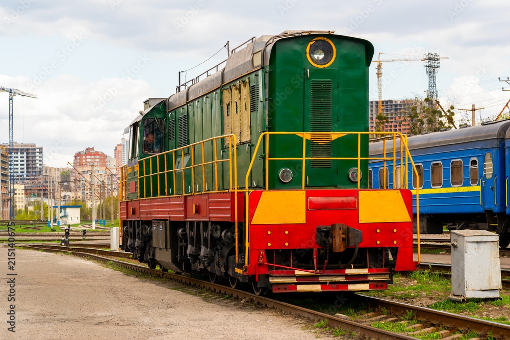 electric shunting train of green color during maneuvers at the railway ...