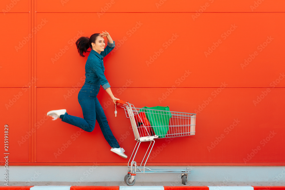 Happy Woman with Shopping Jumping with Joy Stock Photo | Adobe Stock