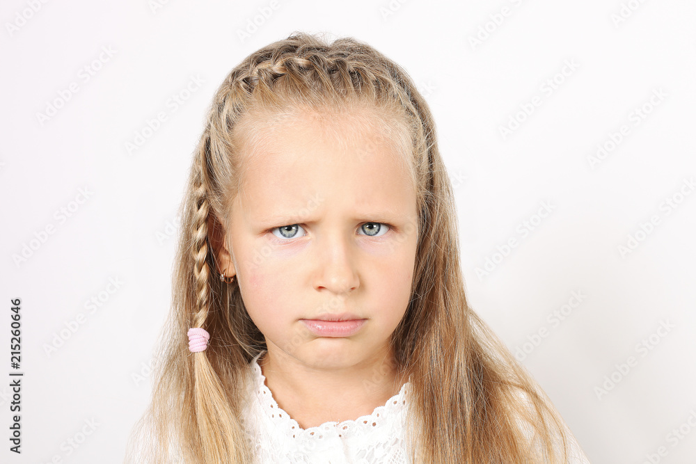 Portrait of sad and funny four year old little girl with blond hair ...