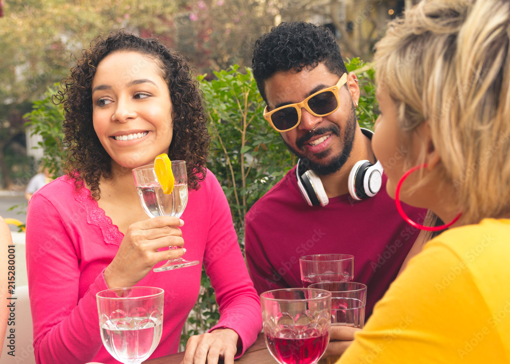 Happy friends socializing in a party at restaurant outside. Summer ...