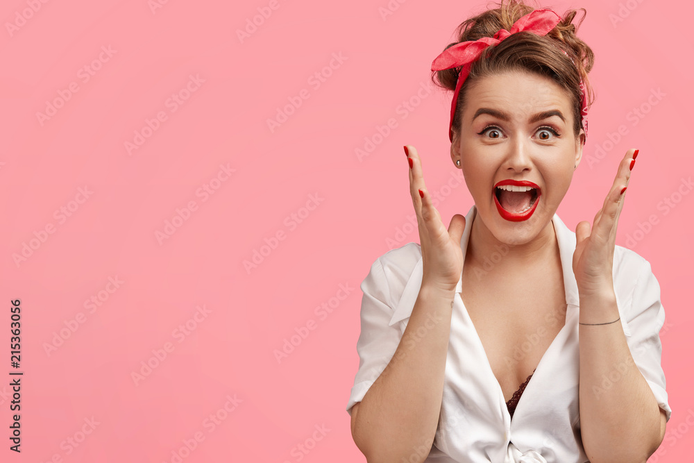 Expressive facial expressions. Pretty amazed overjoyed female with red ...