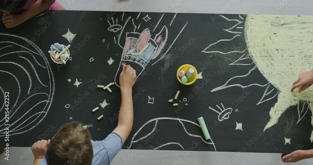multi ethnic children drawing coloring space pictures together on ...