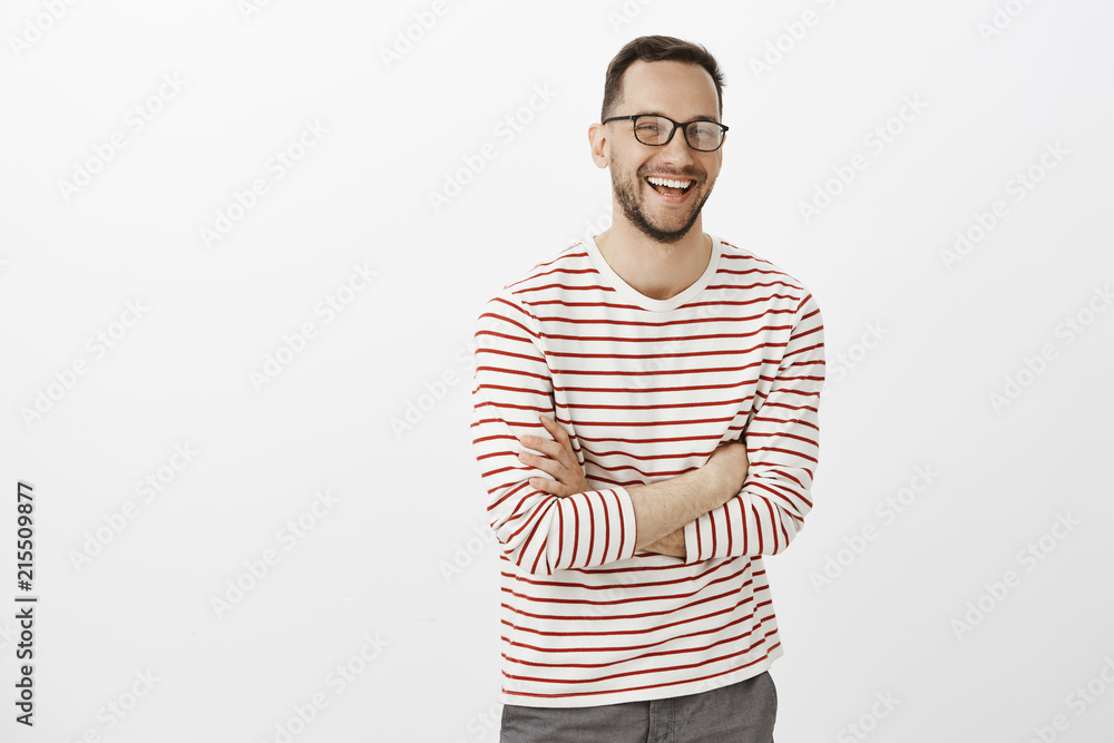 Portrait of timid good-looking european male with beard in glasses ...